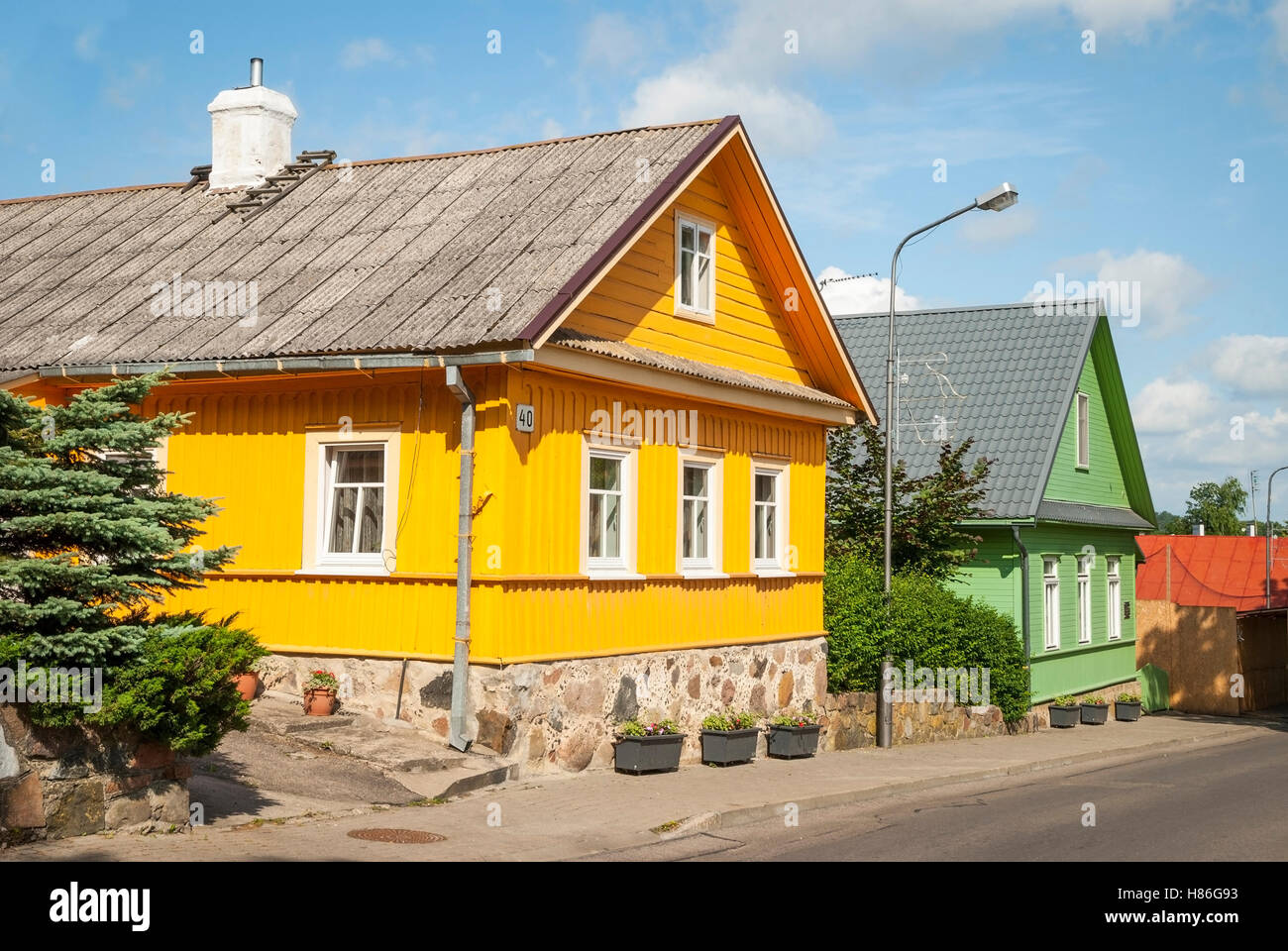Typical lithuanian house by the road in village Stock Photo - Alamy