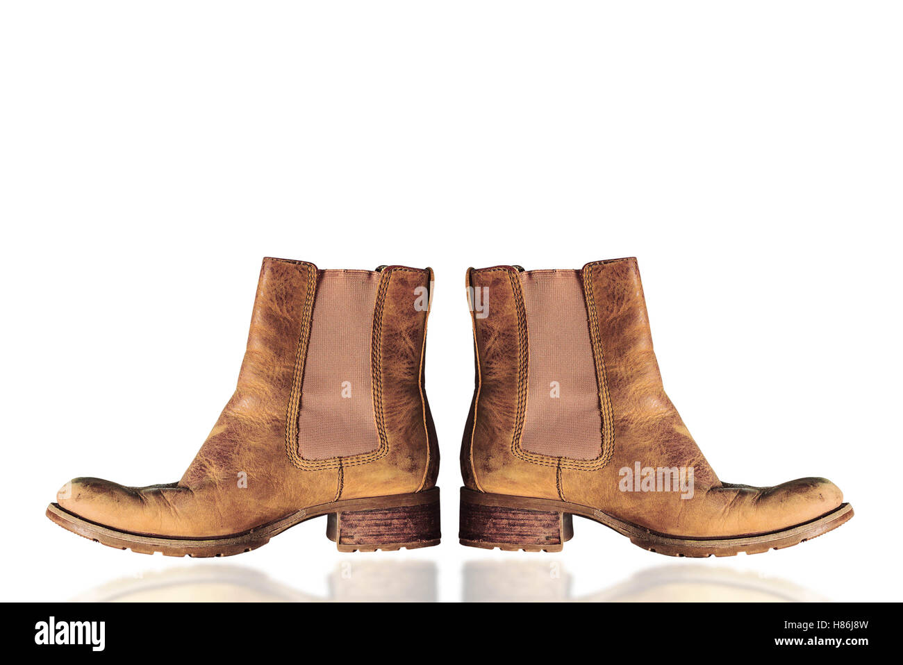 Old leather boots on a white background Stock Photo - Alamy