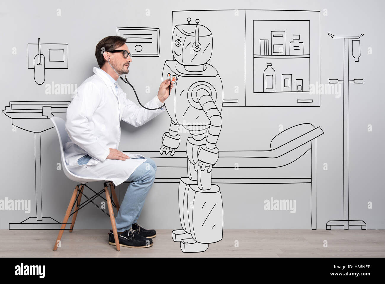 Good looking doctor examine robots heart Stock Photo - Alamy