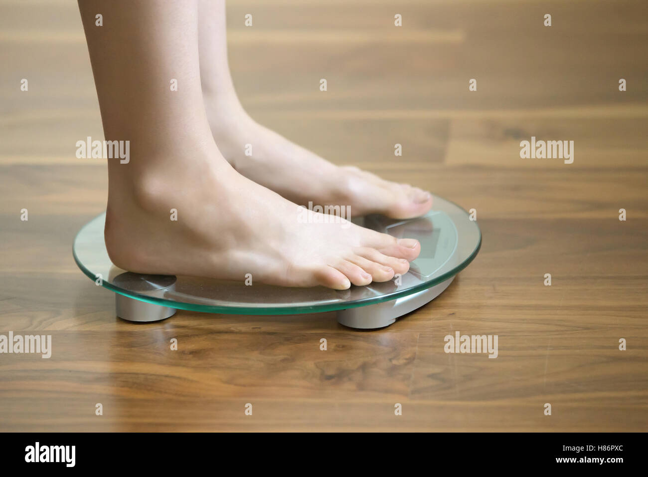 Body mass and scales hi-res stock photography and images - Alamy