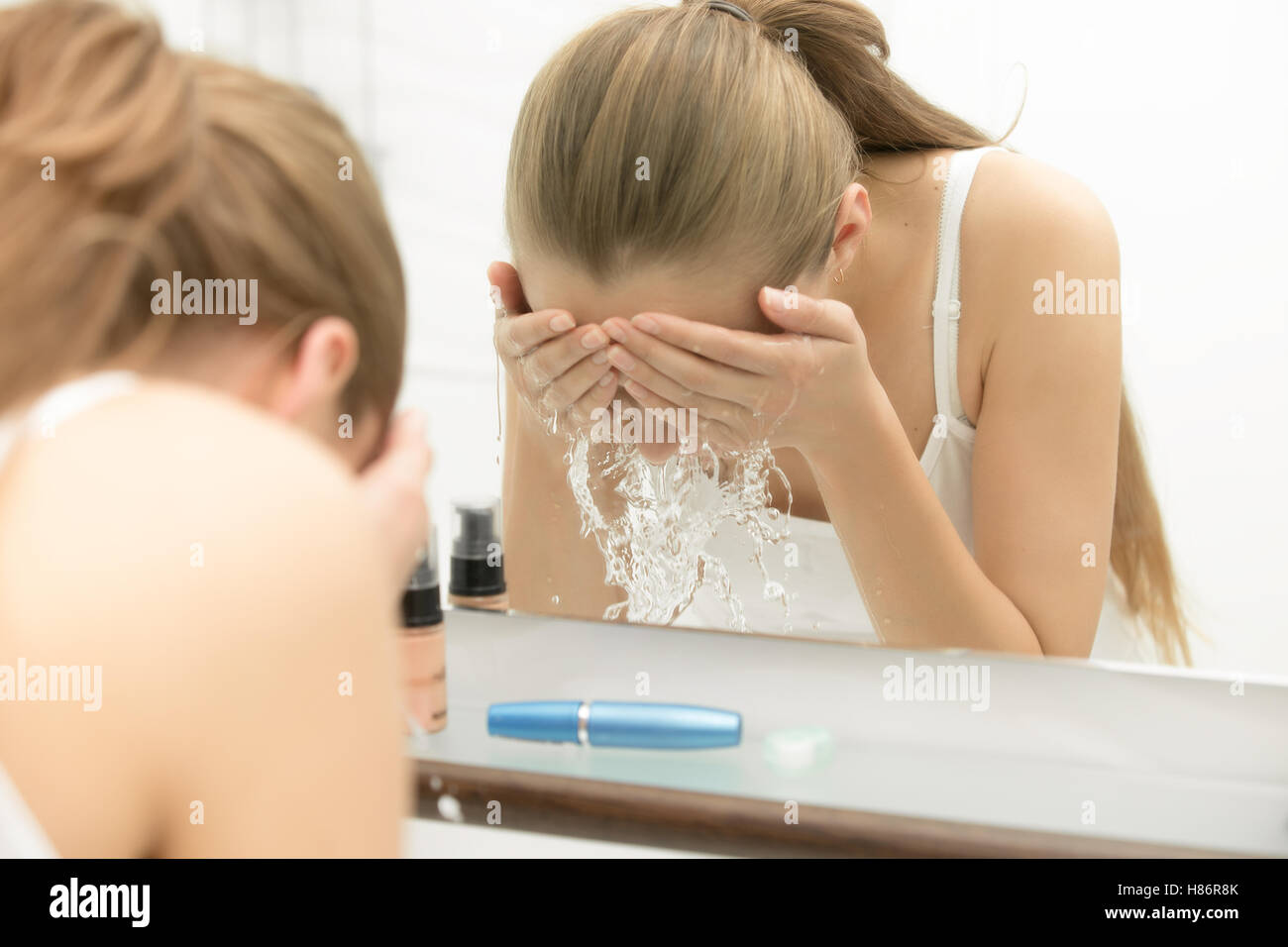 Girl washing face mirror hi-res stock photography and images - Alamy