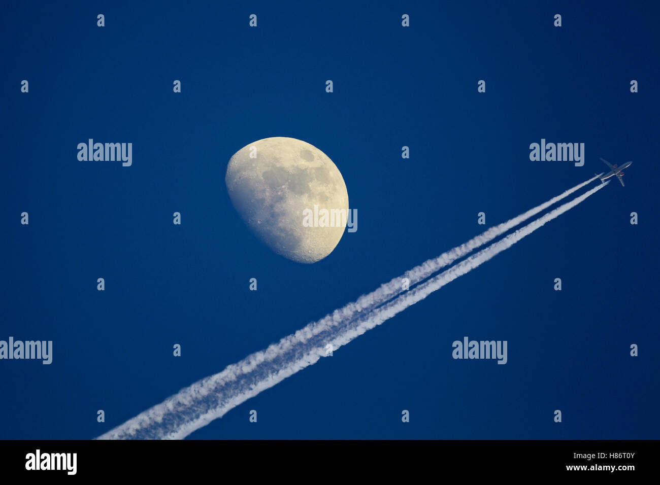 Airplane passing in front of moon, Netherlands Stock Photo - Alamy