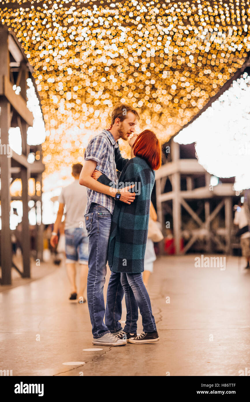 Joy young couple cuddle hi-res stock photography and images - Alamy