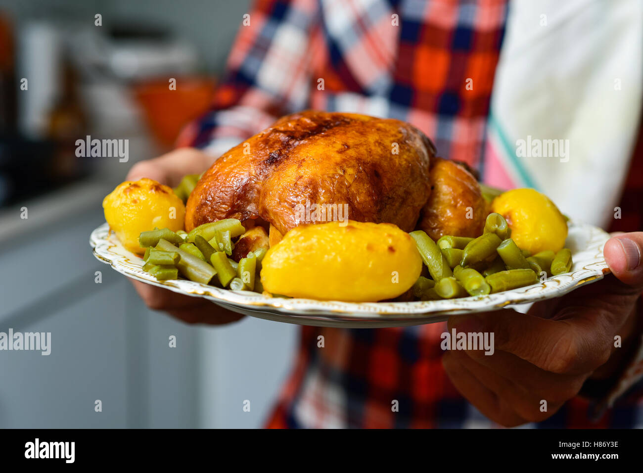Man cooking roast chicken hi-res stock photography and images - Alamy