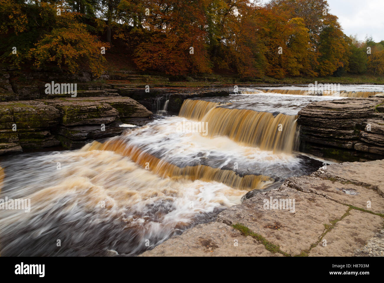 Water fall with fast flowing water Stock Photo - Alamy