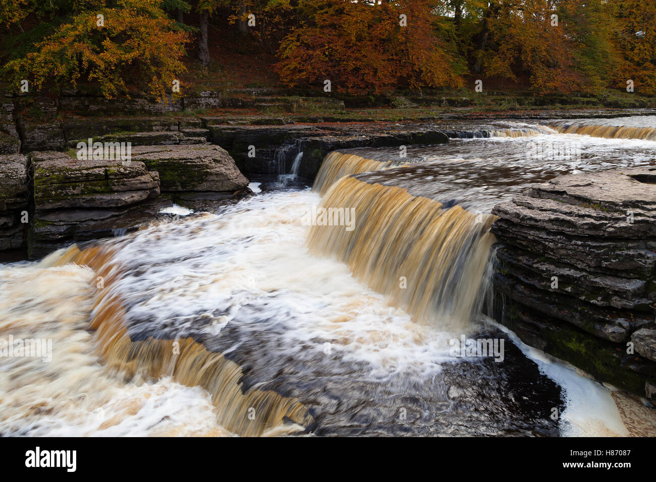 Water fall with fast flowing water Stock Photo - Alamy