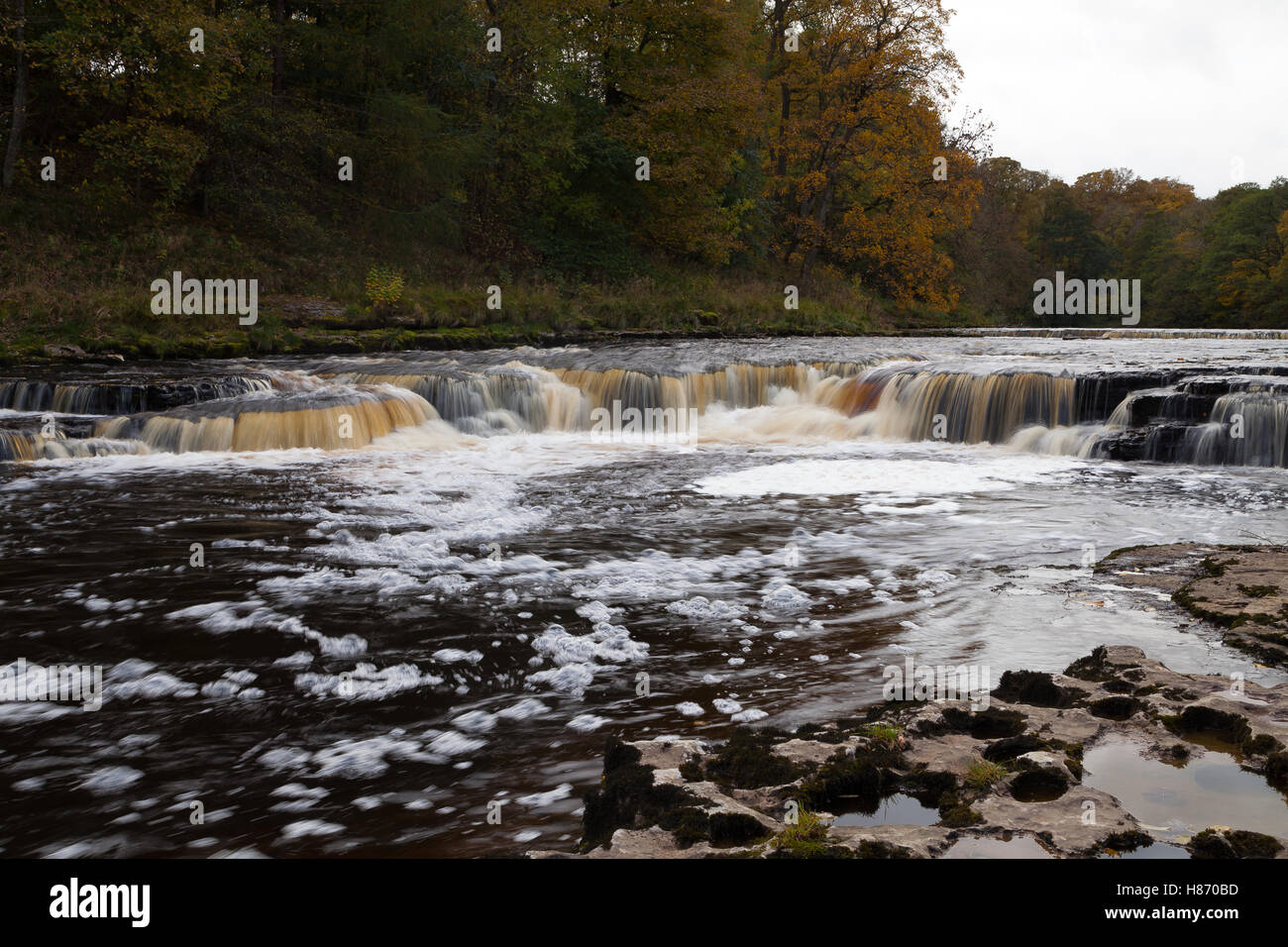 Water fall with fast flowing water Stock Photo - Alamy