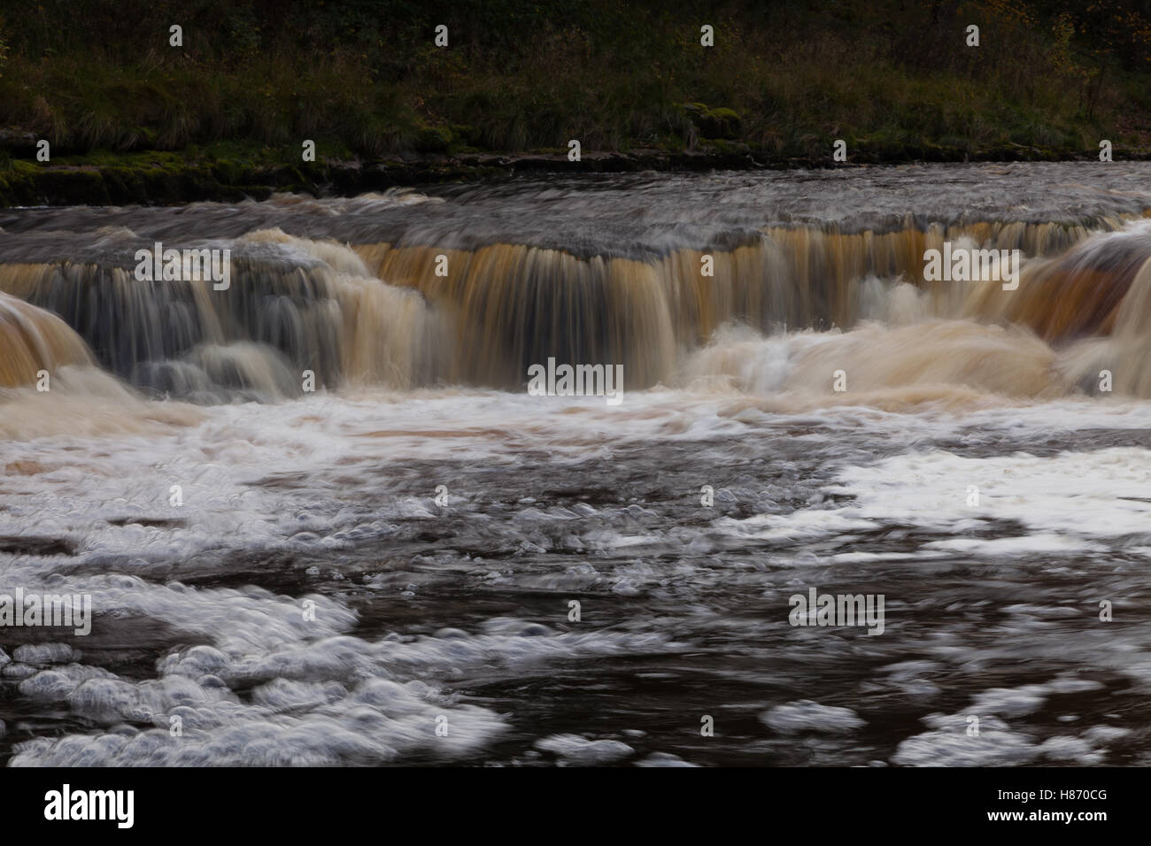 Water fall with fast flowing water Stock Photo - Alamy