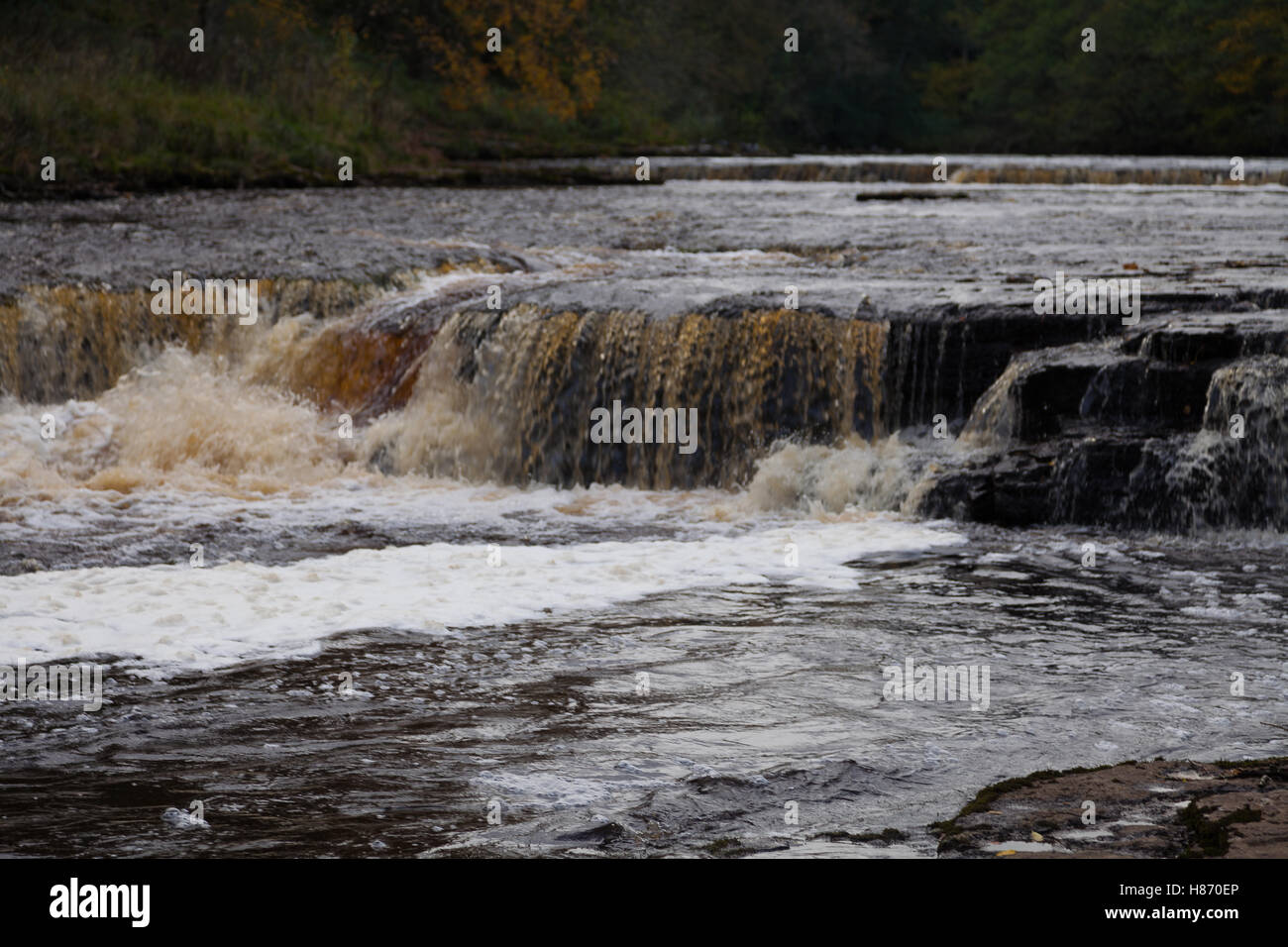 Water fall with fast flowing water Stock Photo - Alamy