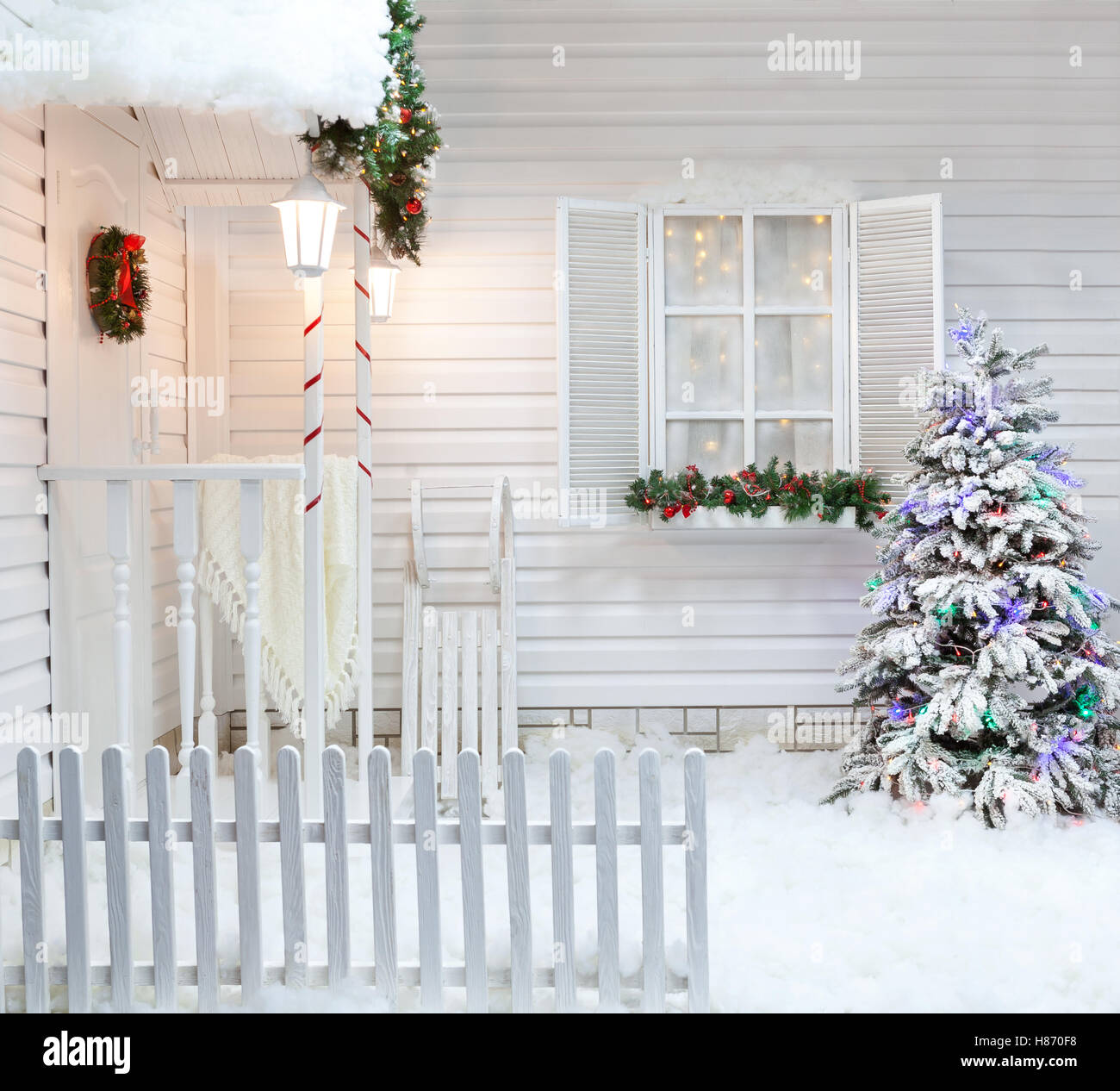 Winter exterior of a country house with Christmas decorations in the ...
