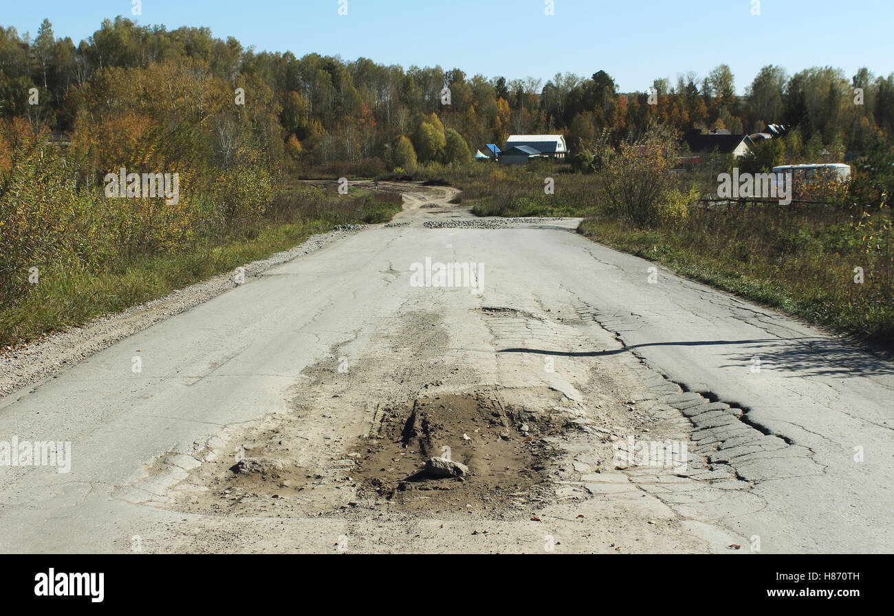 Large pit on the old road Stock Photo - Alamy