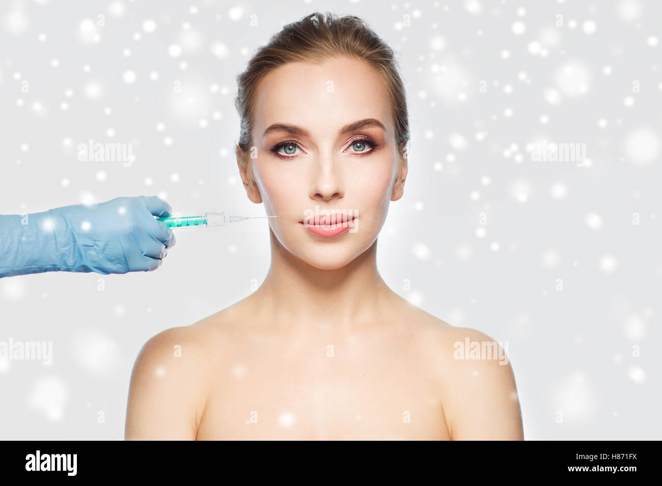 woman face and hand with syringe making injection Stock Photo - Alamy