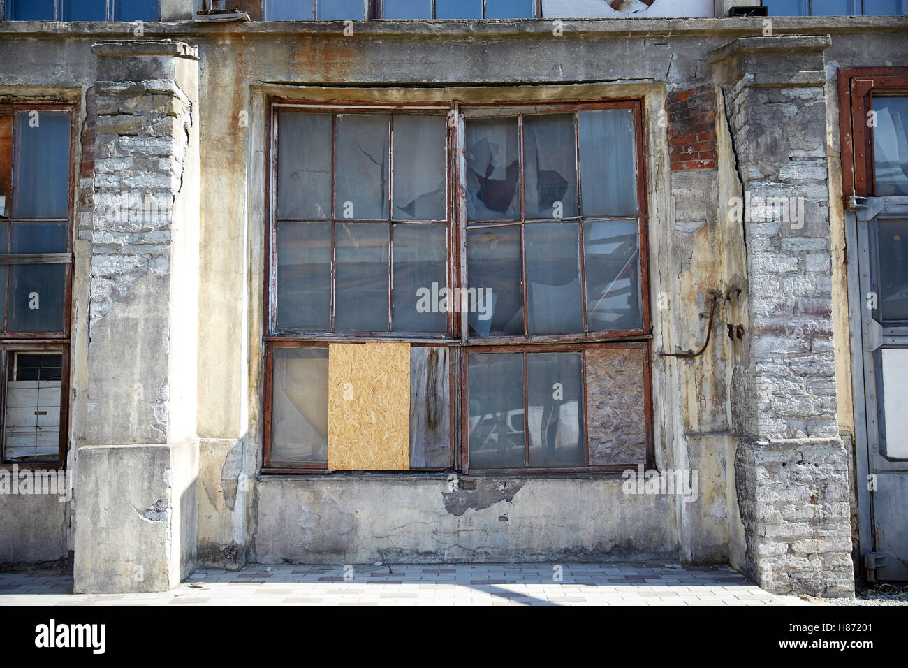 old industrial building with broken glass window Stock Photo - Alamy