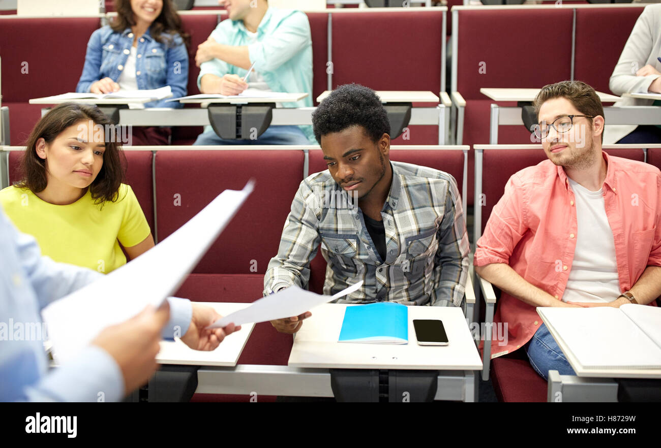 teacher giving tests to students at lecture Stock Photo - Alamy