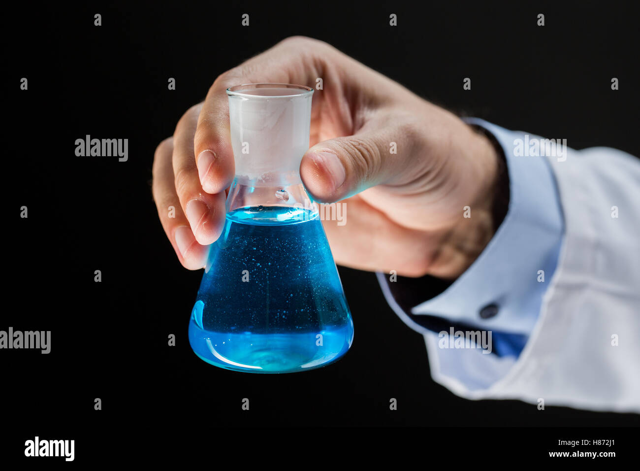 Hand holding chemical flask isolated hi-res stock photography and ...