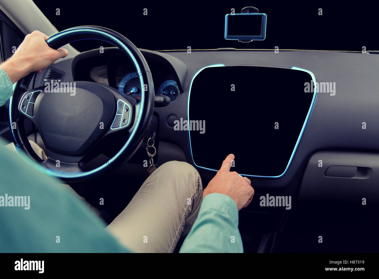 close up of man driving car with on board computer Stock Photo - Alamy