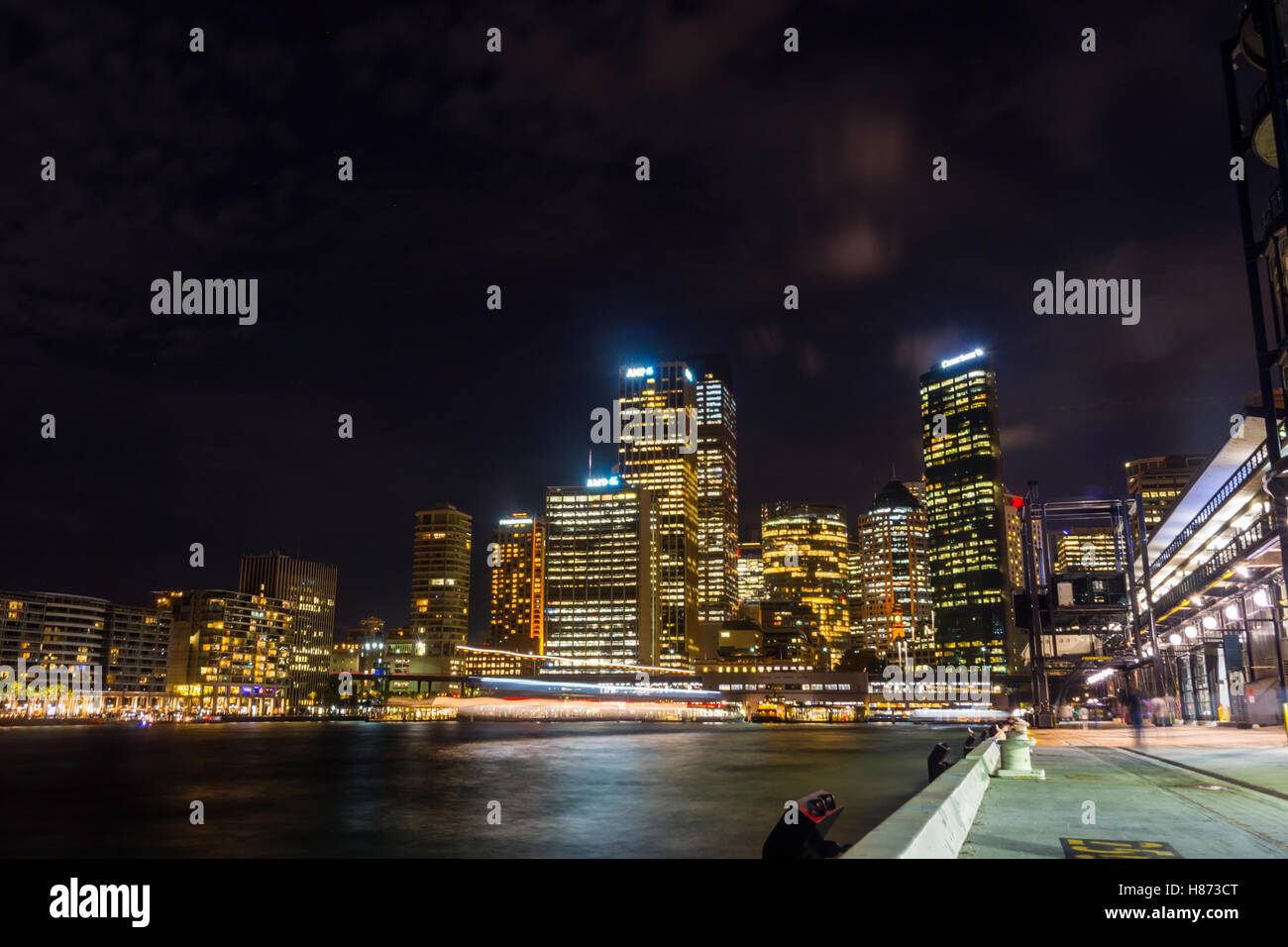 View on Sydney downtown at Circular quay with ferry terminal at night ...