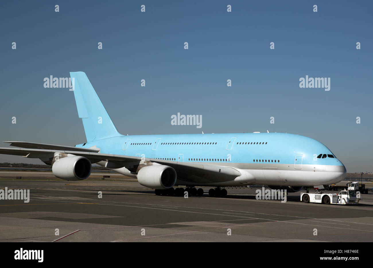 Large passenger jet at an airport Stock Photo - Alamy