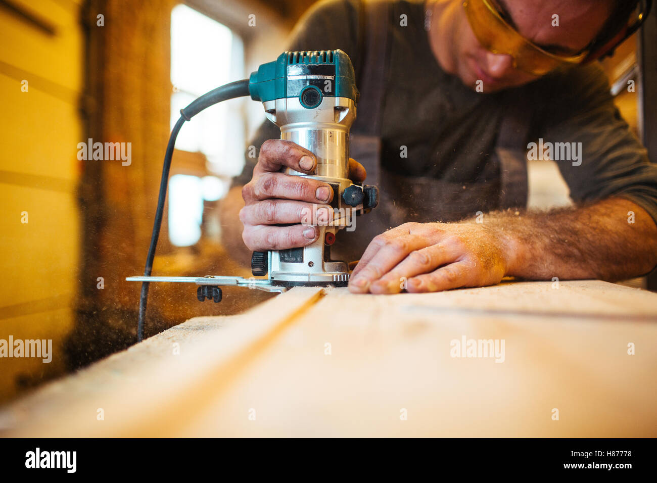 Working with power tool Stock Photo - Alamy