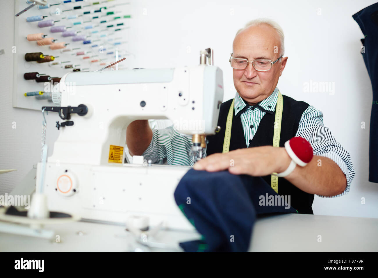 Tailor working in workshop hi-res stock photography and images - Alamy
