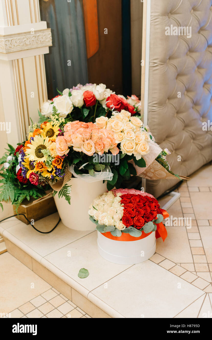 Boxes with roses stand on the floor in restaurant Stock Photo - Alamy