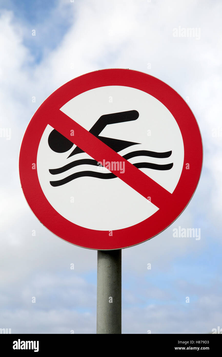 Swimming Warning Sign against Blue Sky Stock Photo - Alamy