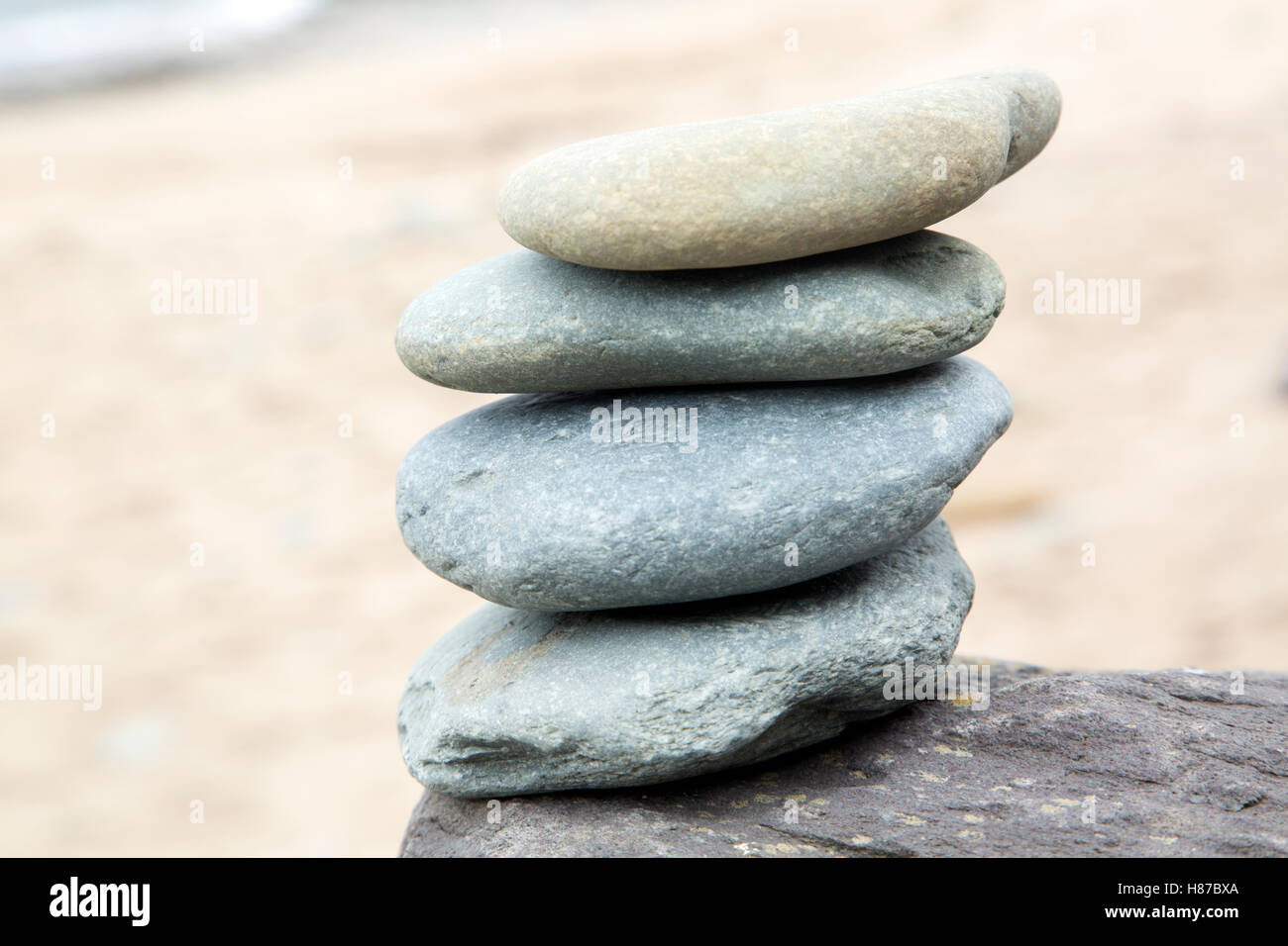 Stack of Four Stones on Beach Stock Photo - Alamy