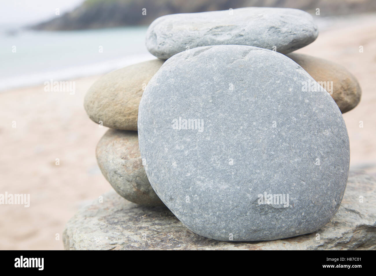 Stack of Round Stones on Beach Stock Photo - Alamy