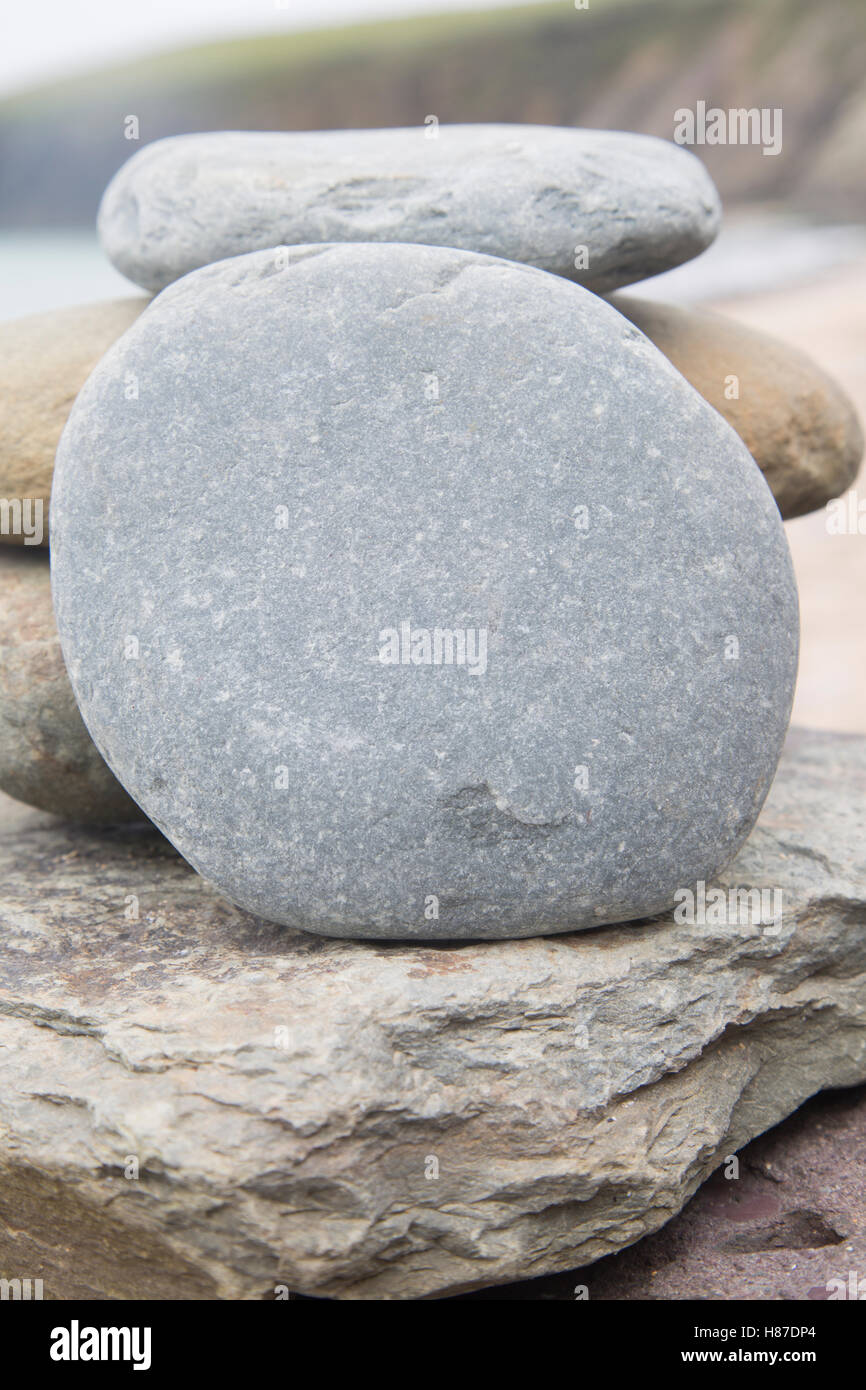 Stack of Round Stones on Beach Stock Photo - Alamy