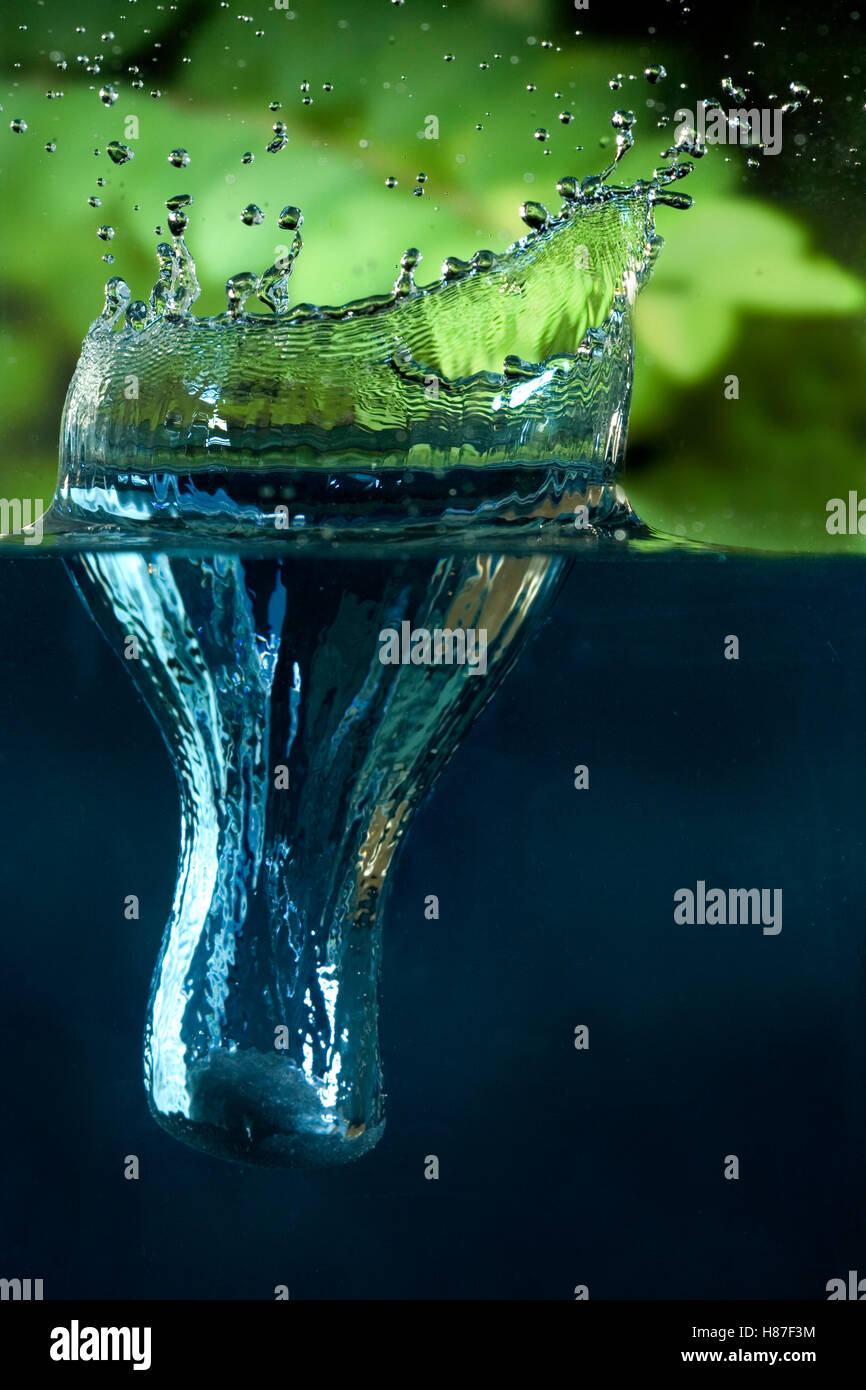 A rock splashing into water. Photographed with a high-speed camera ...