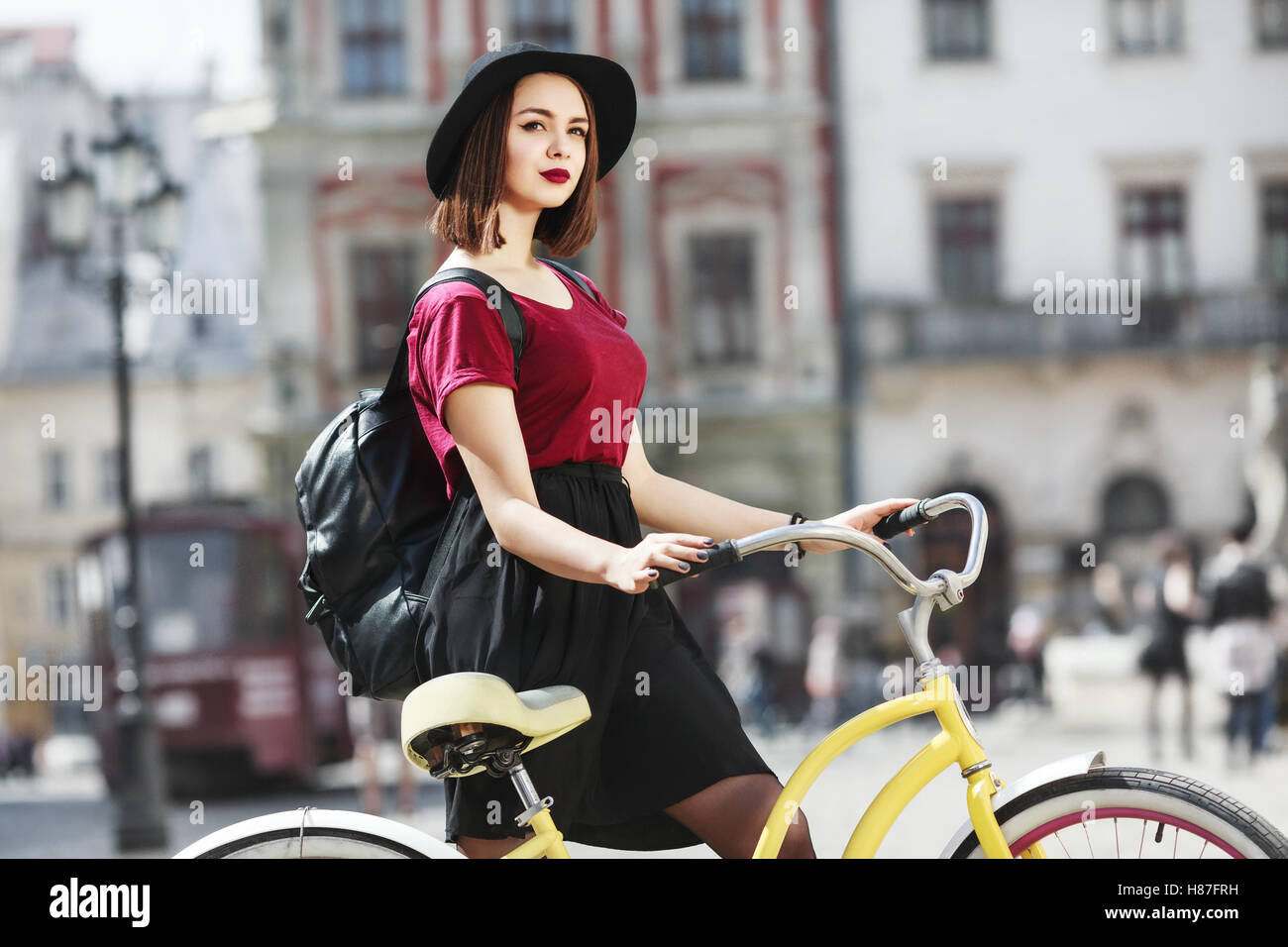 Beautiful girl riding a bicycle Stock Photo - Alamy