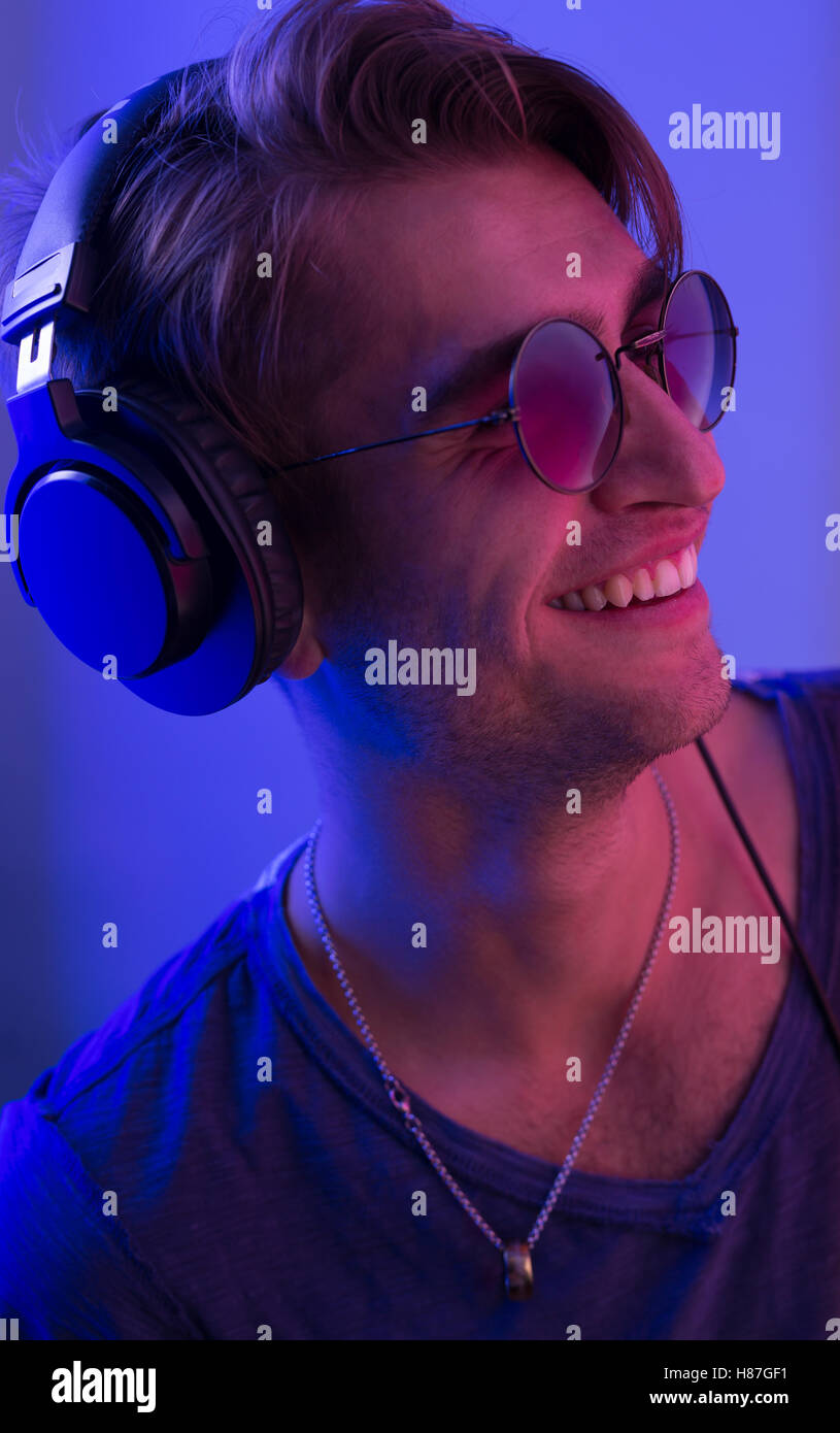 dj with headphones in nightclub party scene, toned image Stock Photo ...