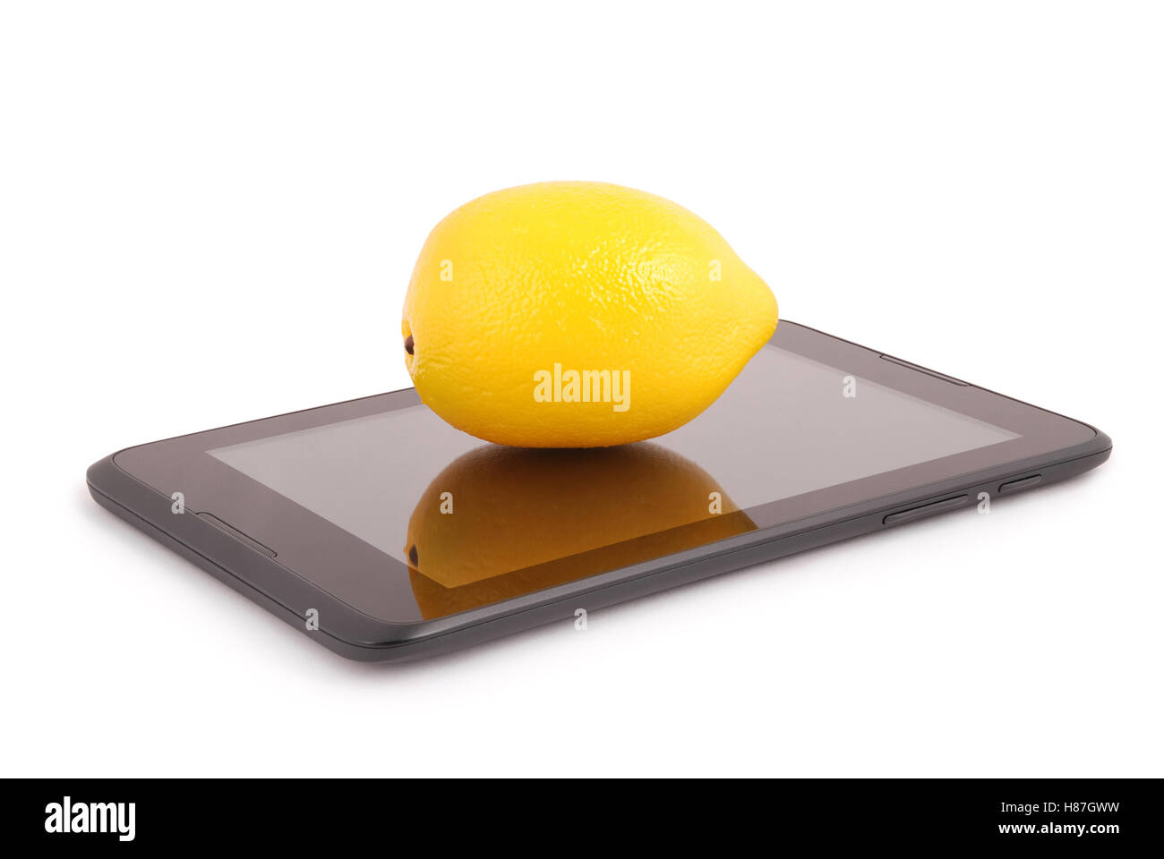 Yellow lemon on a tablet PC. Photo with clipping path Stock Photo - Alamy