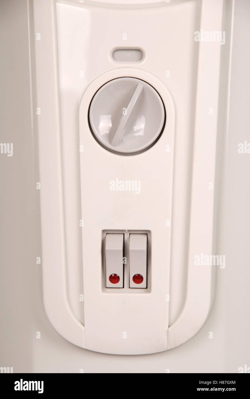 Toggle switch with red LED on the electric radiator Stock Photo - Alamy