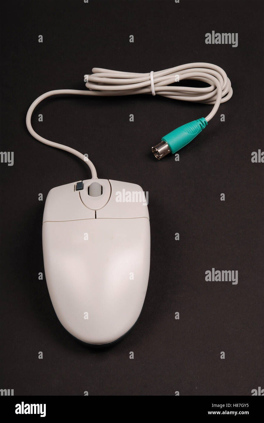 White computer optical mouse isolated on black background with soft ...