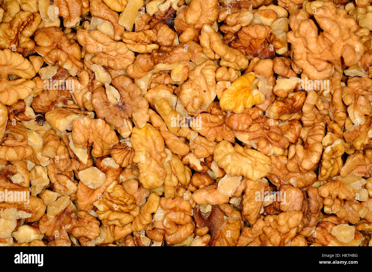 Closeup photo of pile dried walnuts, background Stock Photo - Alamy