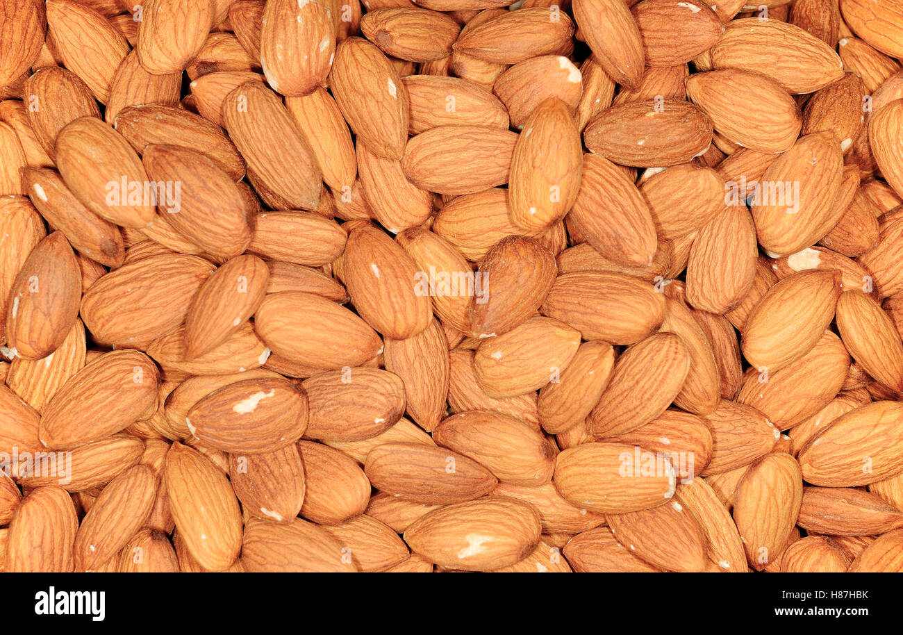 Almonds background, detail Stock Photo - Alamy