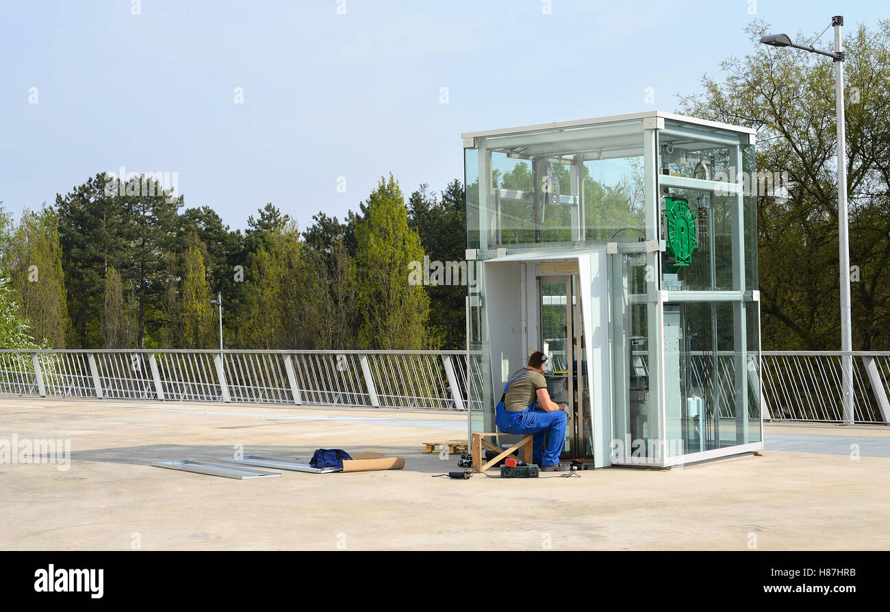 Elevator mechanic in work Stock Photo - Alamy