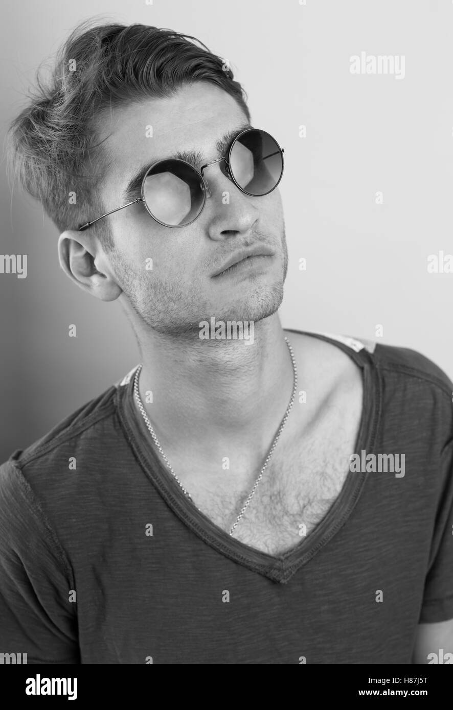 Portrait of young man on gray background Stock Photo - Alamy