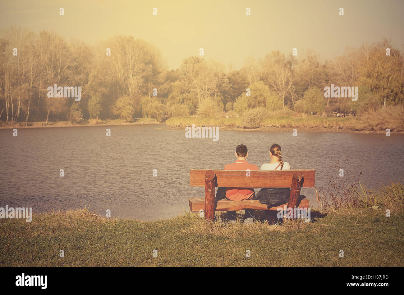 Vintage photo of a bench near the lake Stock Photo - Alamy