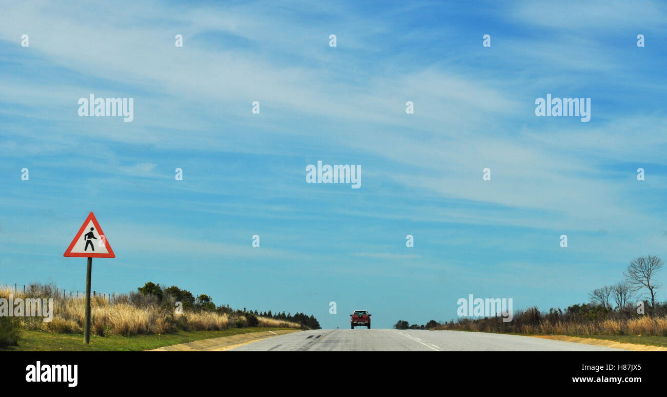 South Africa, driving on the road: warning sign for pedestrians ...