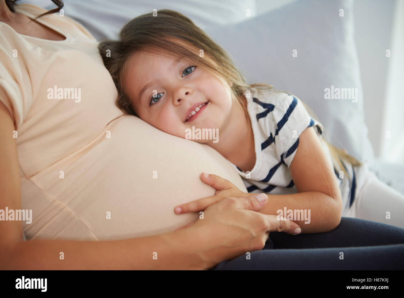Woman embracing her two children Stock Photo - Alamy