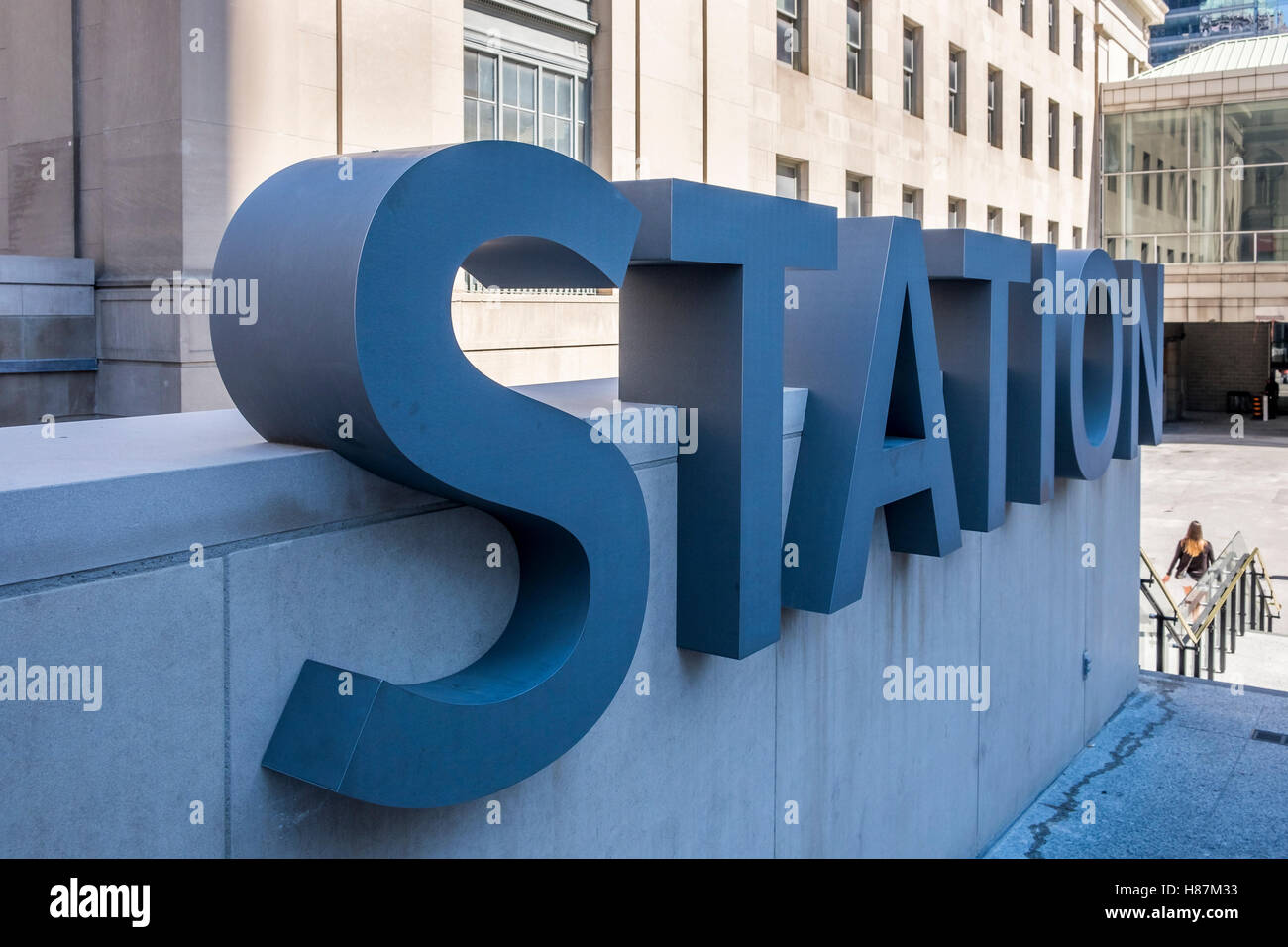 A blue station sign at the top of the stairs outside Union Station in ...