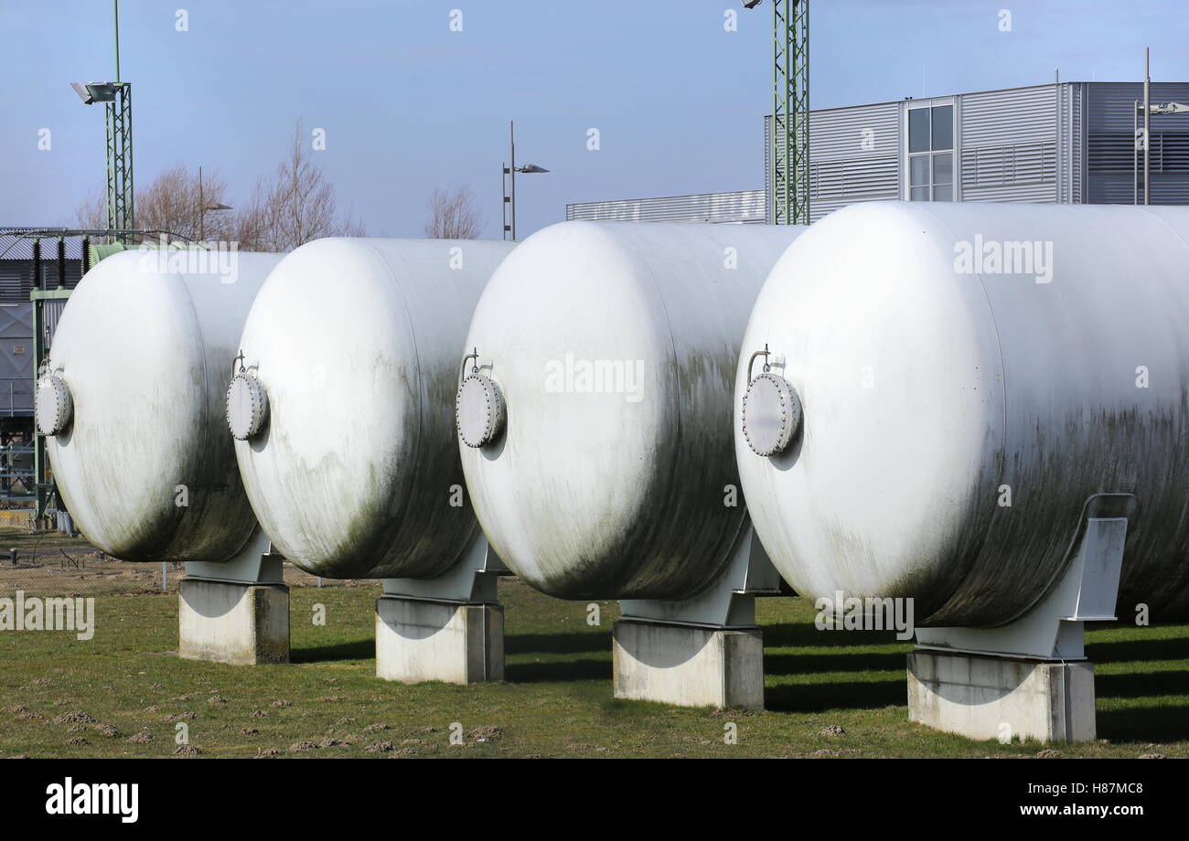 Four industrial gas tanks in a row Stock Photo - Alamy