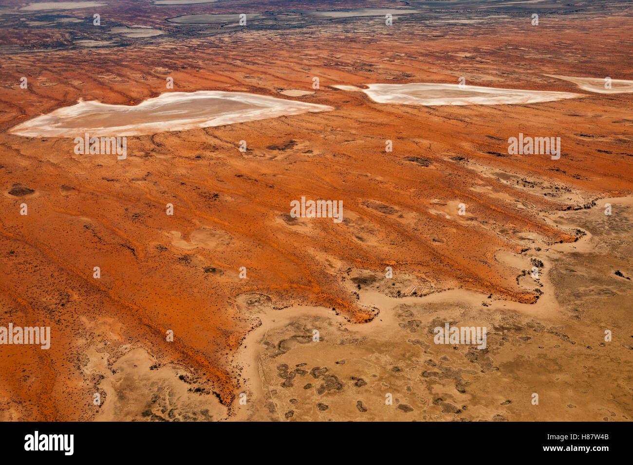 Salt lakes and sand dunes in desert, Sturt Stony Desert, Queensland ...