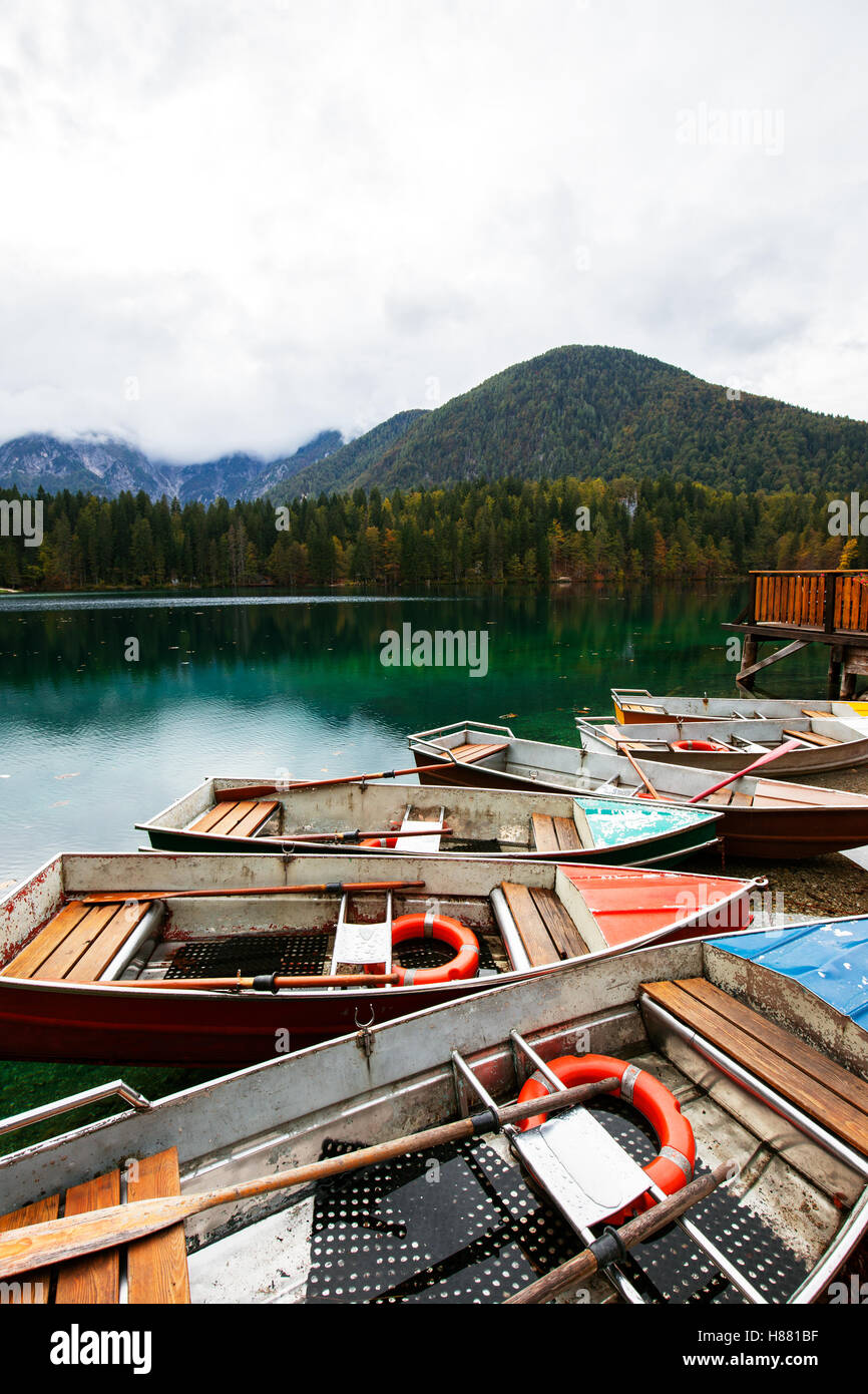 Alpine landscape and colorful boats near Slovenian-Italy border, Lake ...