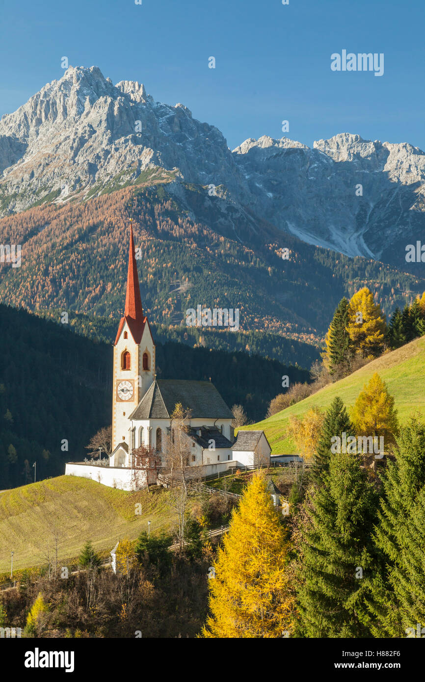 Iconic alpine church in Winnebach, South Tyrol, Italy. Autumn morning ...