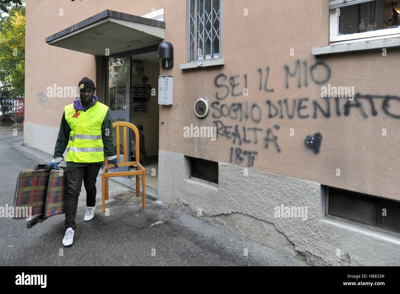 Milan, (Italy), a group of refugees and asylum seekers clean up ...