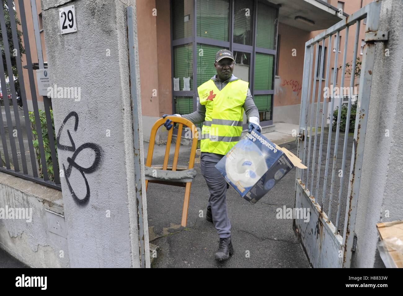 Milan, (Italy), a group of refugees and asylum seekers clean up ...