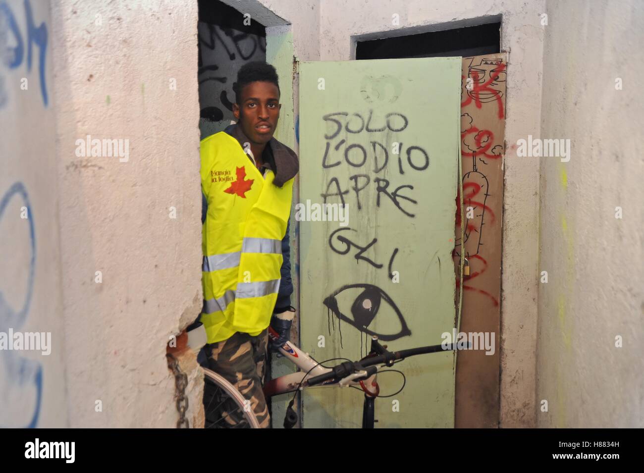 Milan, (Italy), a group of refugees and asylum seekers clean up ...